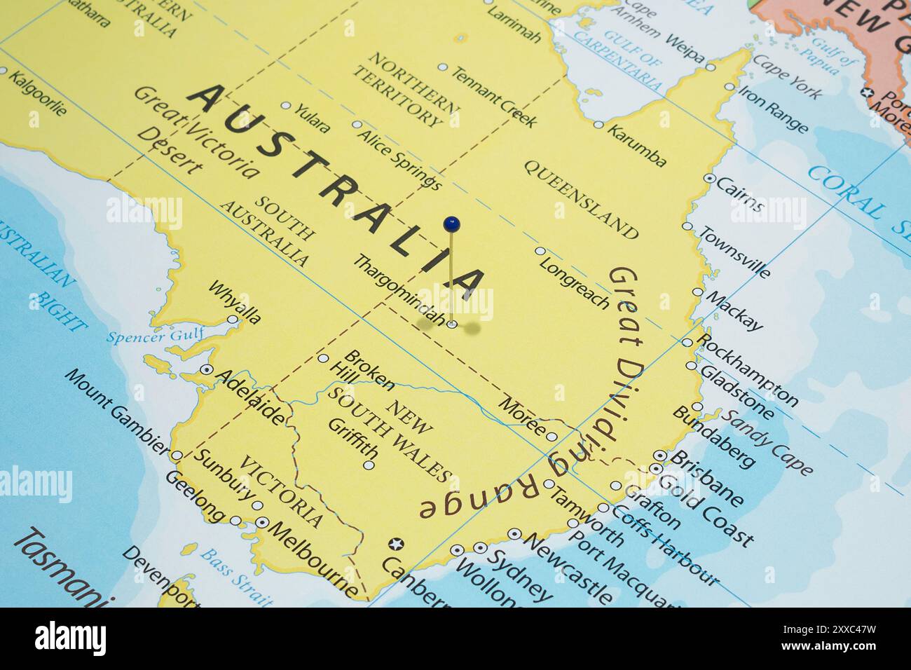 Close up to a Thargomindah city with a blue pin needle into Australia ...