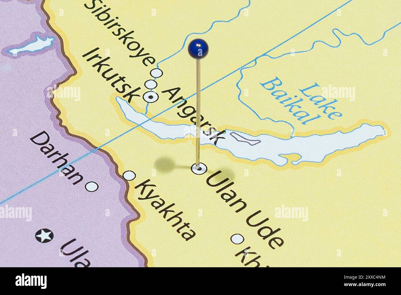 Close up to a Ulan Ude city with a blue pin needle into Russia country ...