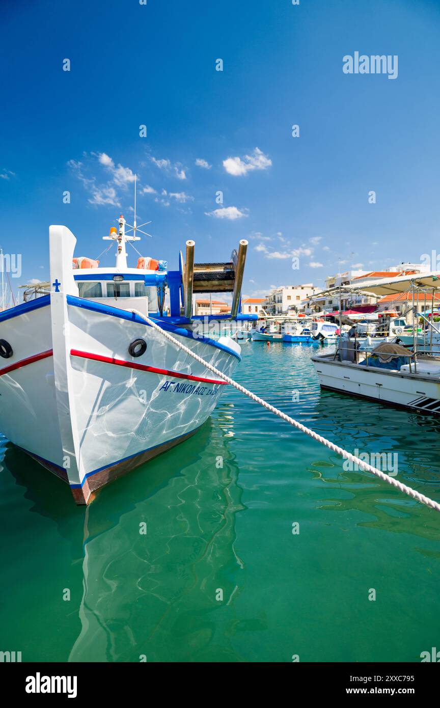 Serene harbor scene on Aegina Island, Greece, featuring a traditional ...