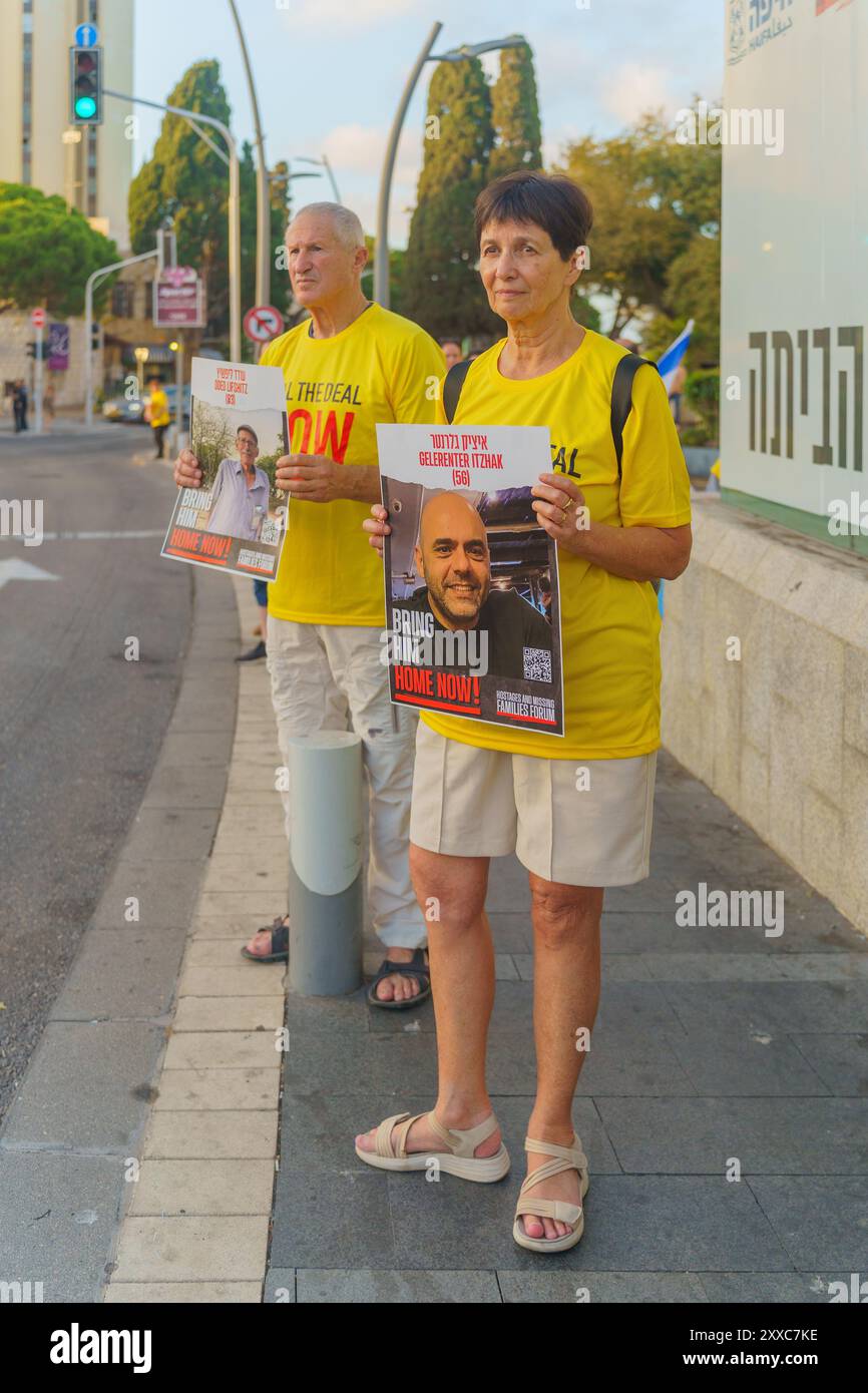 Haifa, Israel - August 22, 2024: People with posters of hostages stand ...