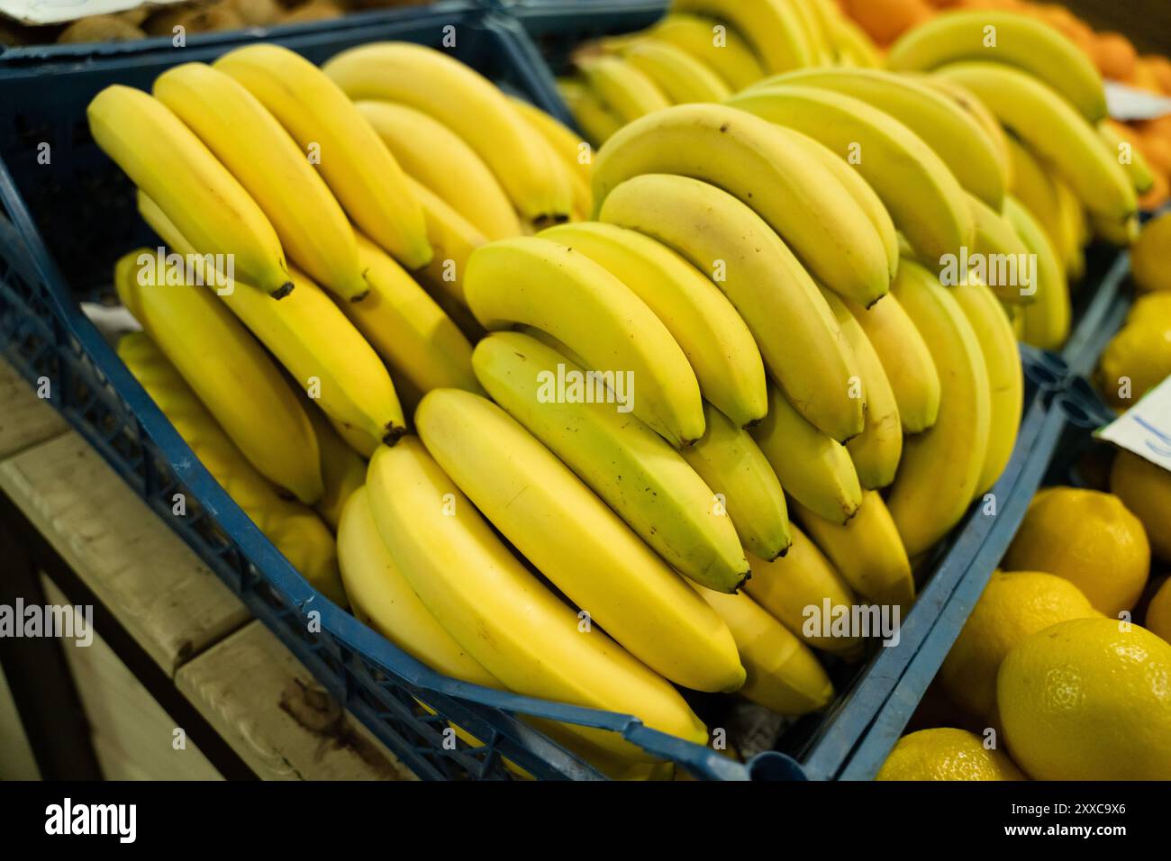 Fresh bananas in plastic boxes on the big market Stock Photo - Alamy