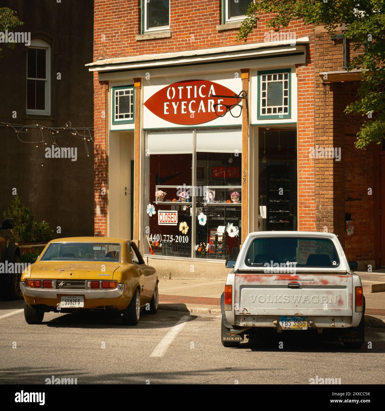 Vintage truck and car with Ottica Eyecare vintage sign, Oberlin, Ohio ...