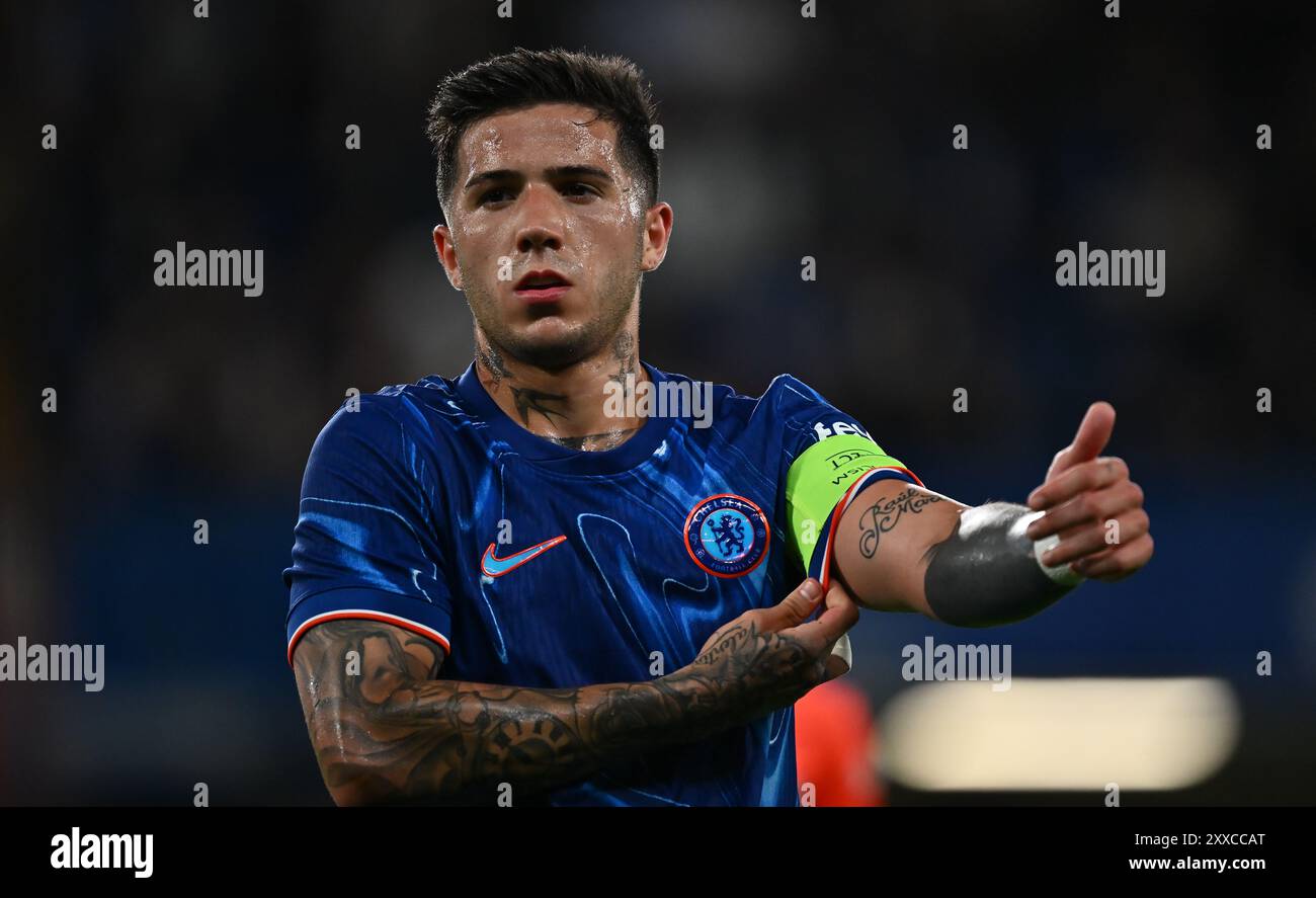 LONDON, ENGLAND - AUGUST 22: Enzo Fernandez of Chelsea tidy up captain ...