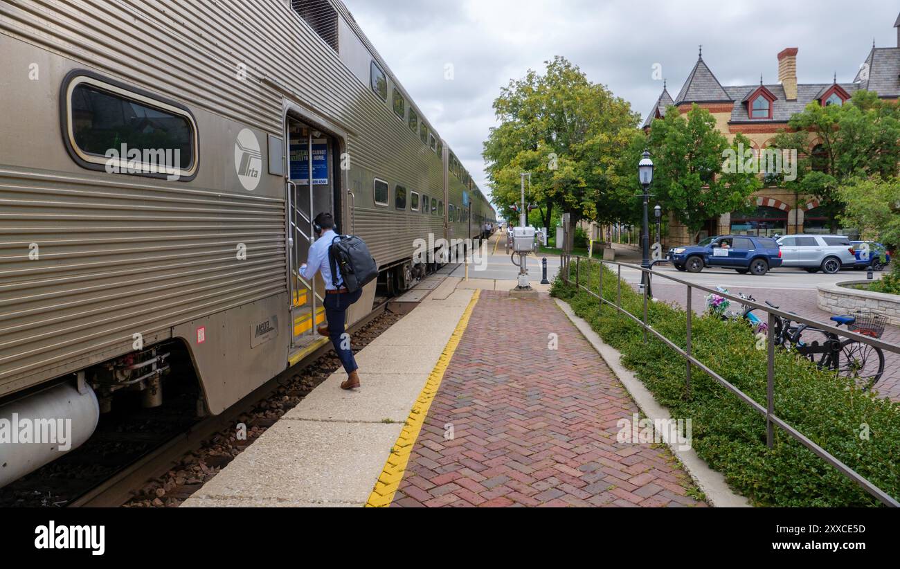 Man boarding inbound BNSF Metra commuter train, Riverside, Illinois ...