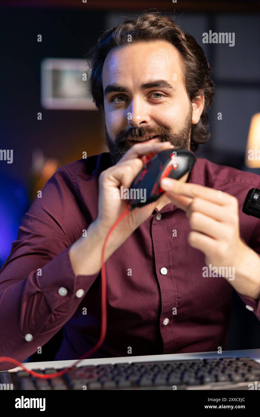 Portrait of cheerful influencer filming video for online channel in ...