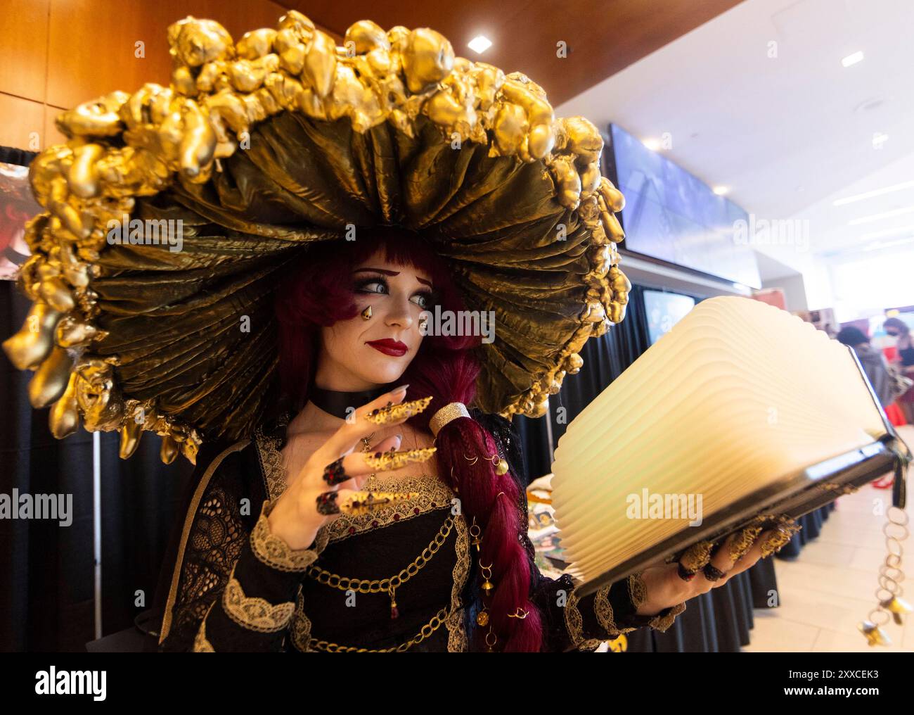 Toronto, Canada. 23rd Aug, 2024. A cosplayer poses for photos during ...