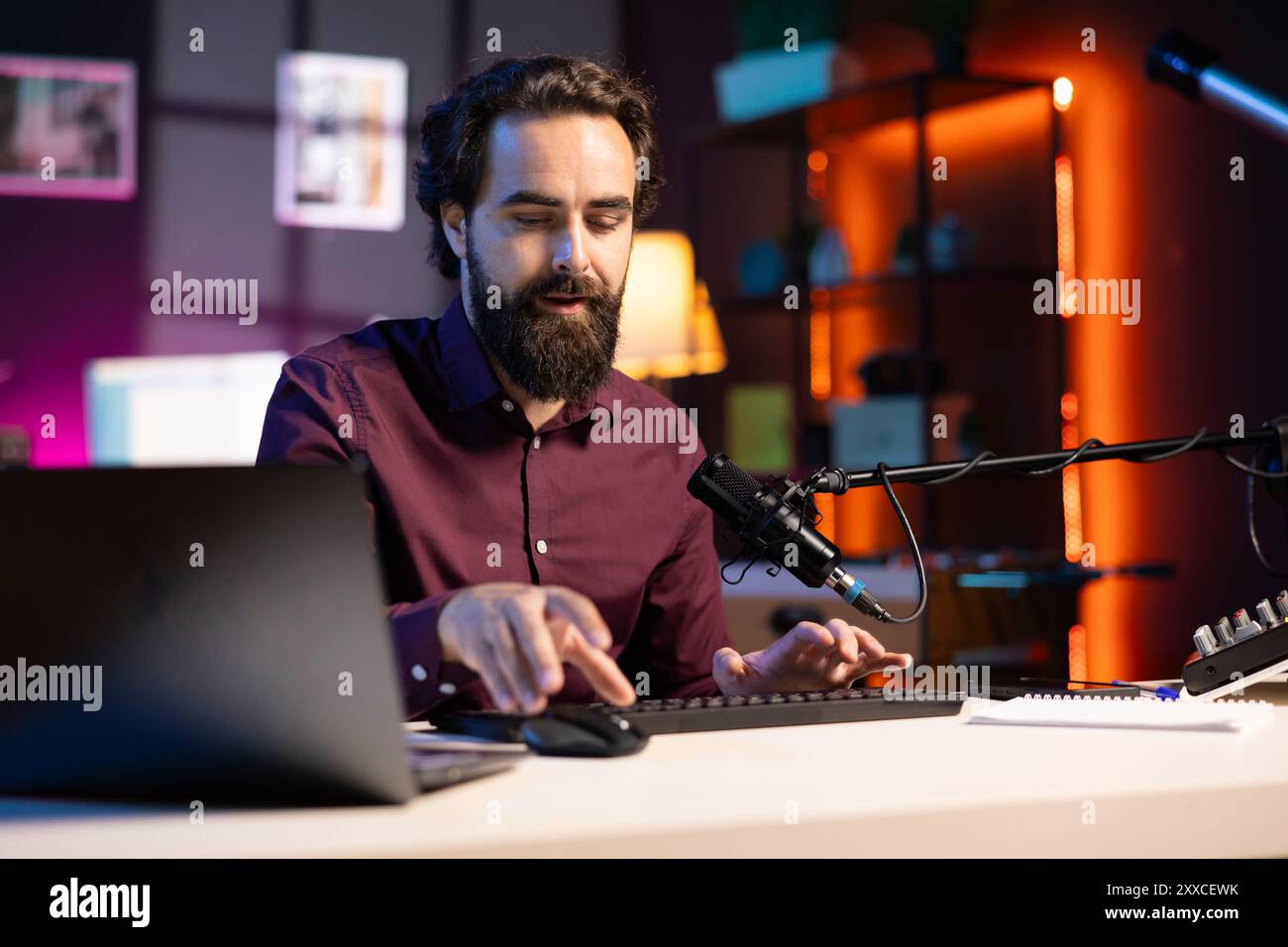 Tech guru filming tutorial for online channel in studio, presenting ...