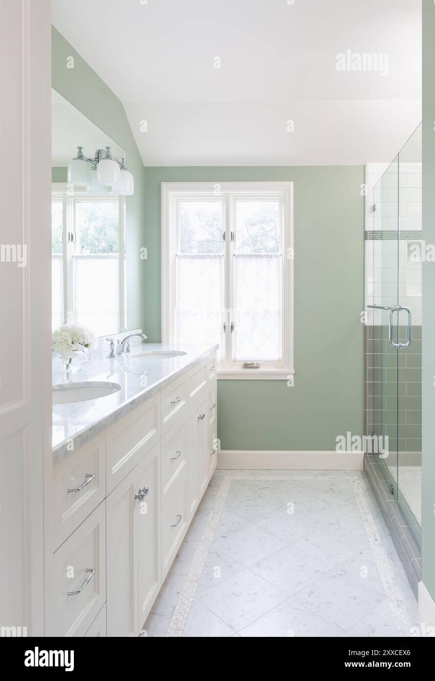Bright airy bathroom with double vanity and walk-in shower Stock Photo ...