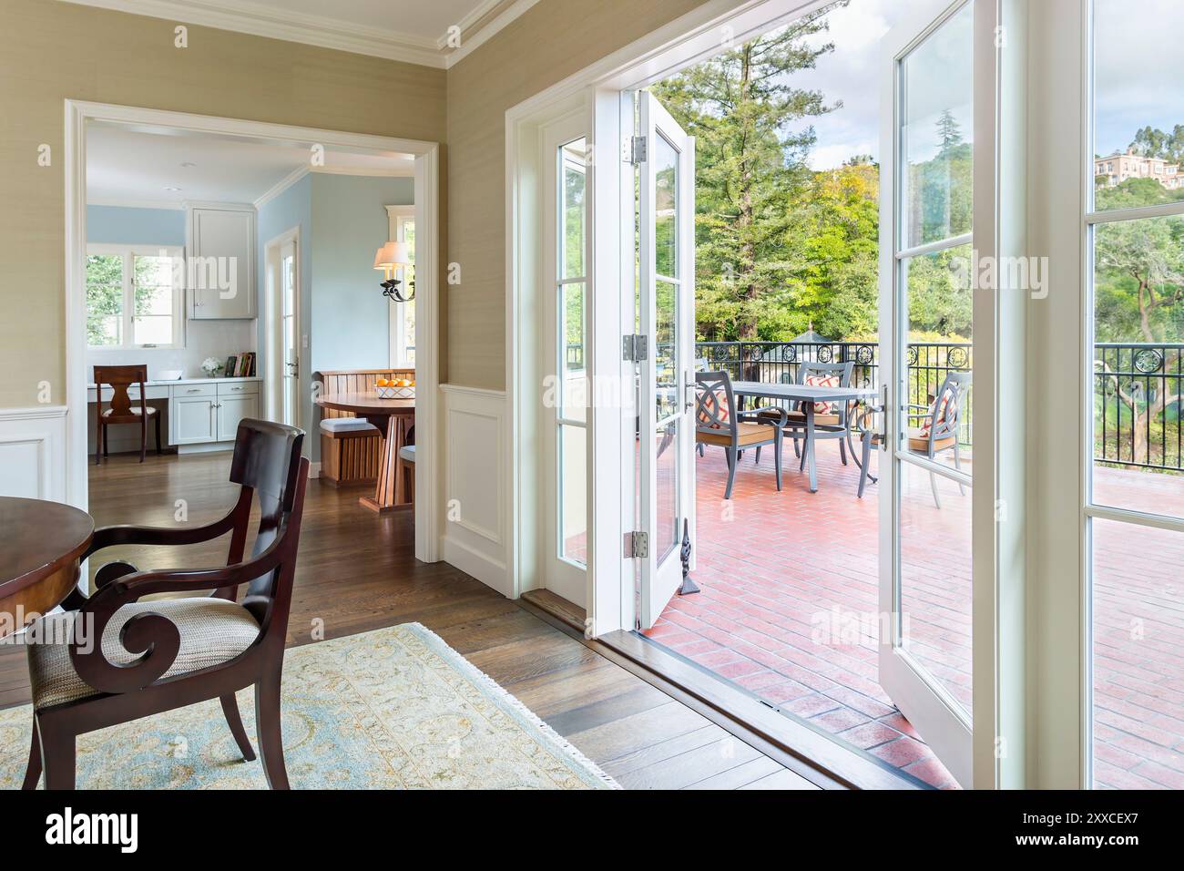 View from dining room outside French doors to patio with kitchen in ...