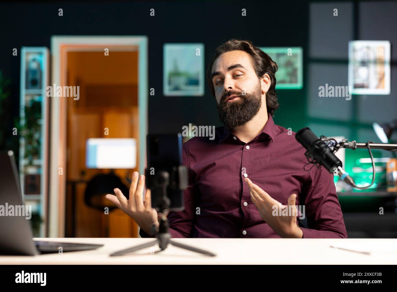 ASMR creator with high tech mic and smartphone on tripod does anti ...