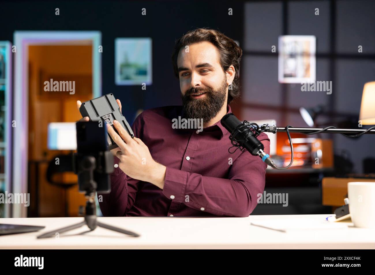 Tech expert presenting V mount battery, filming technology review using ...