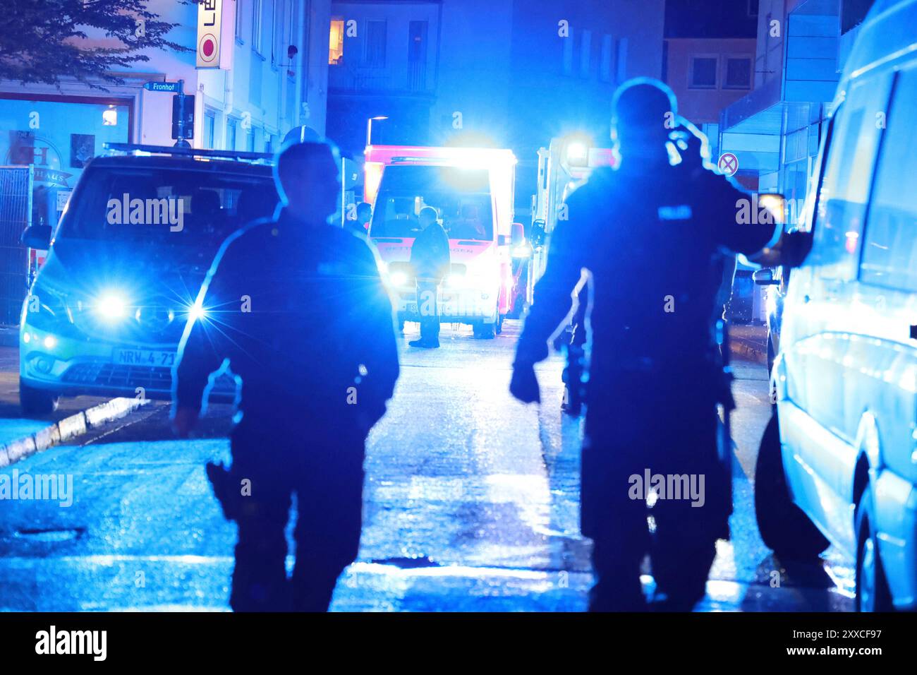 Police and ambulances near the scene where people were killed and ...
