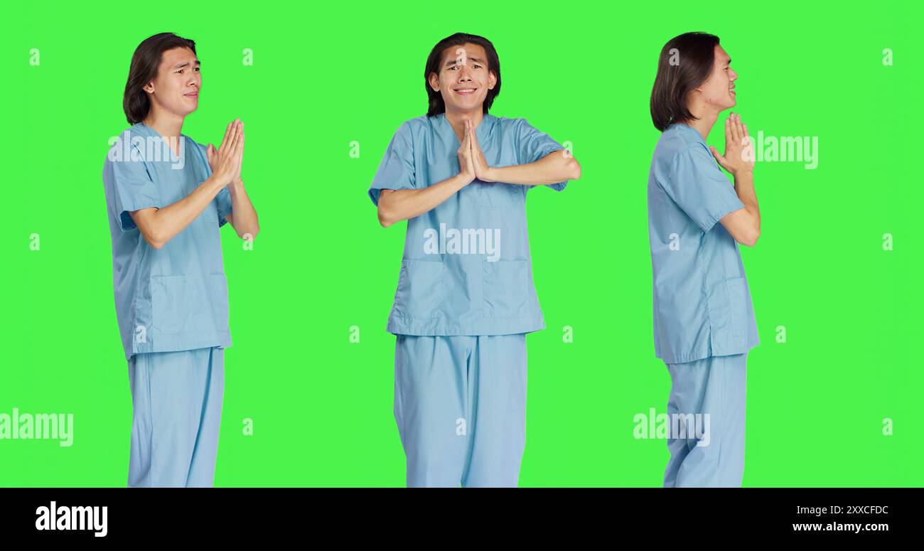 Medical assistant praying to Jesus in studio, holding hands in a prayer ...