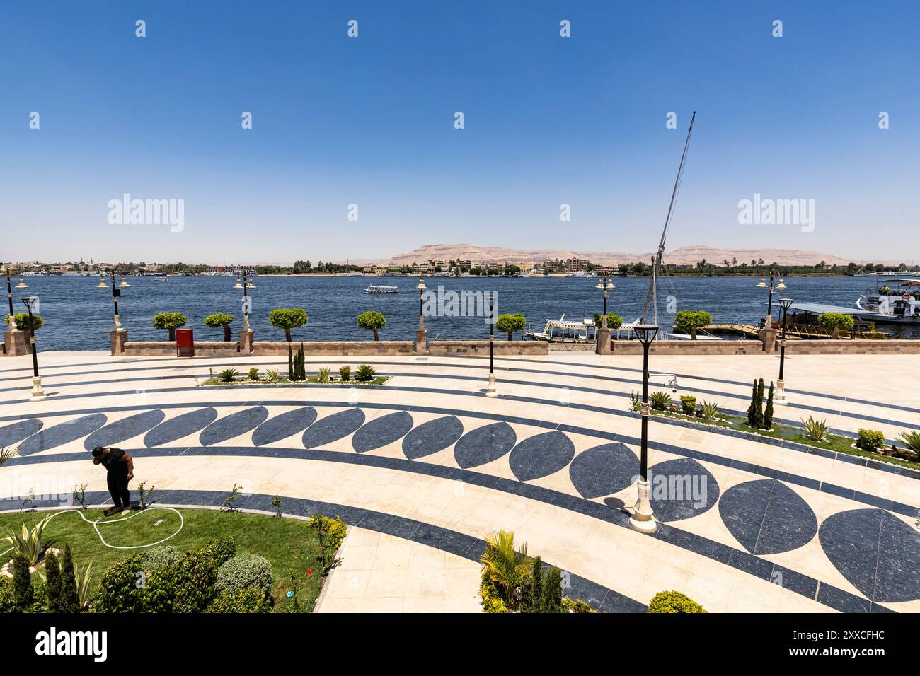 East bank of the Nile, riverside park with ports, downtown, city center ...