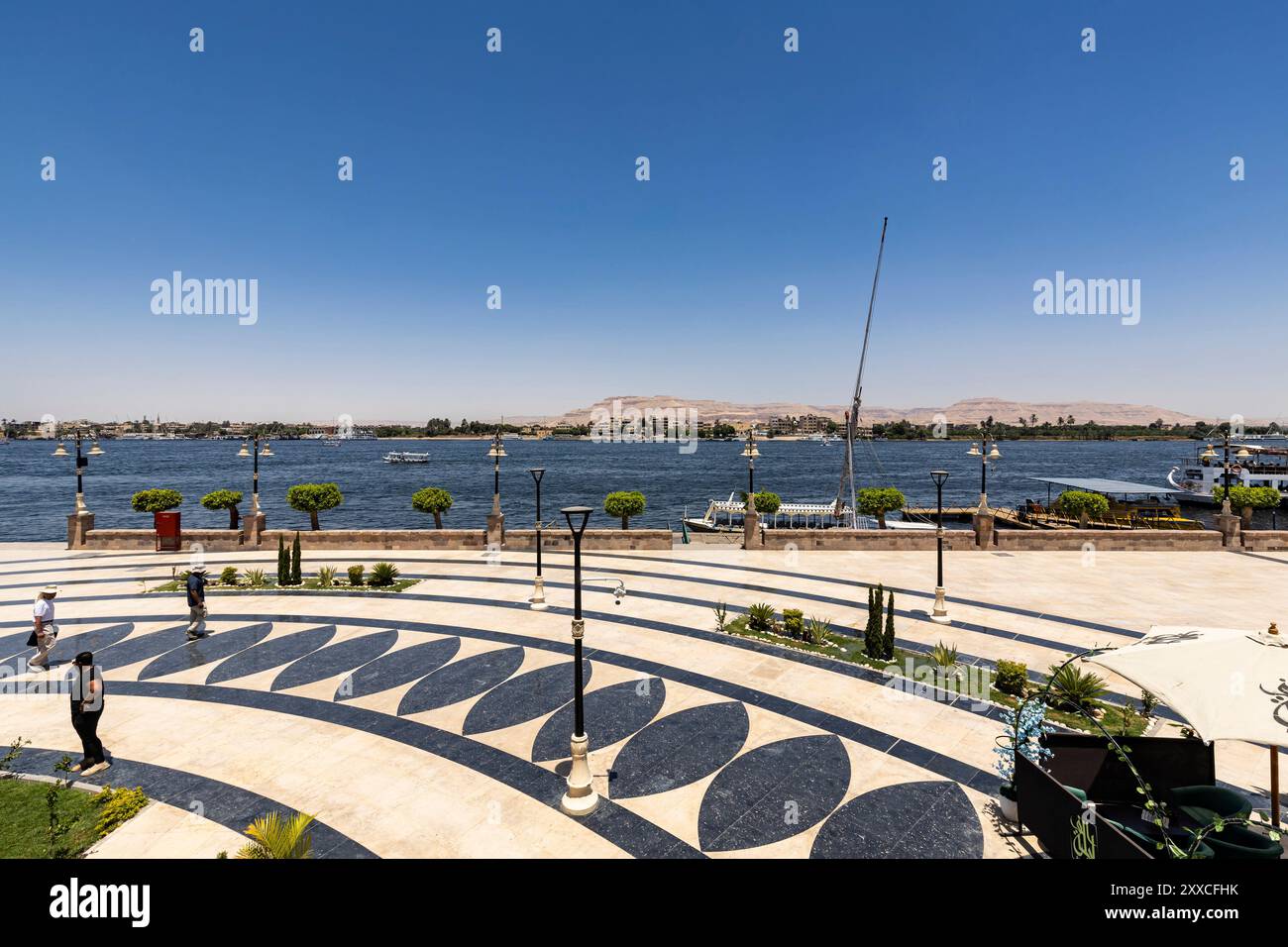 East bank of the Nile, riverside park with ports, downtown, city center ...