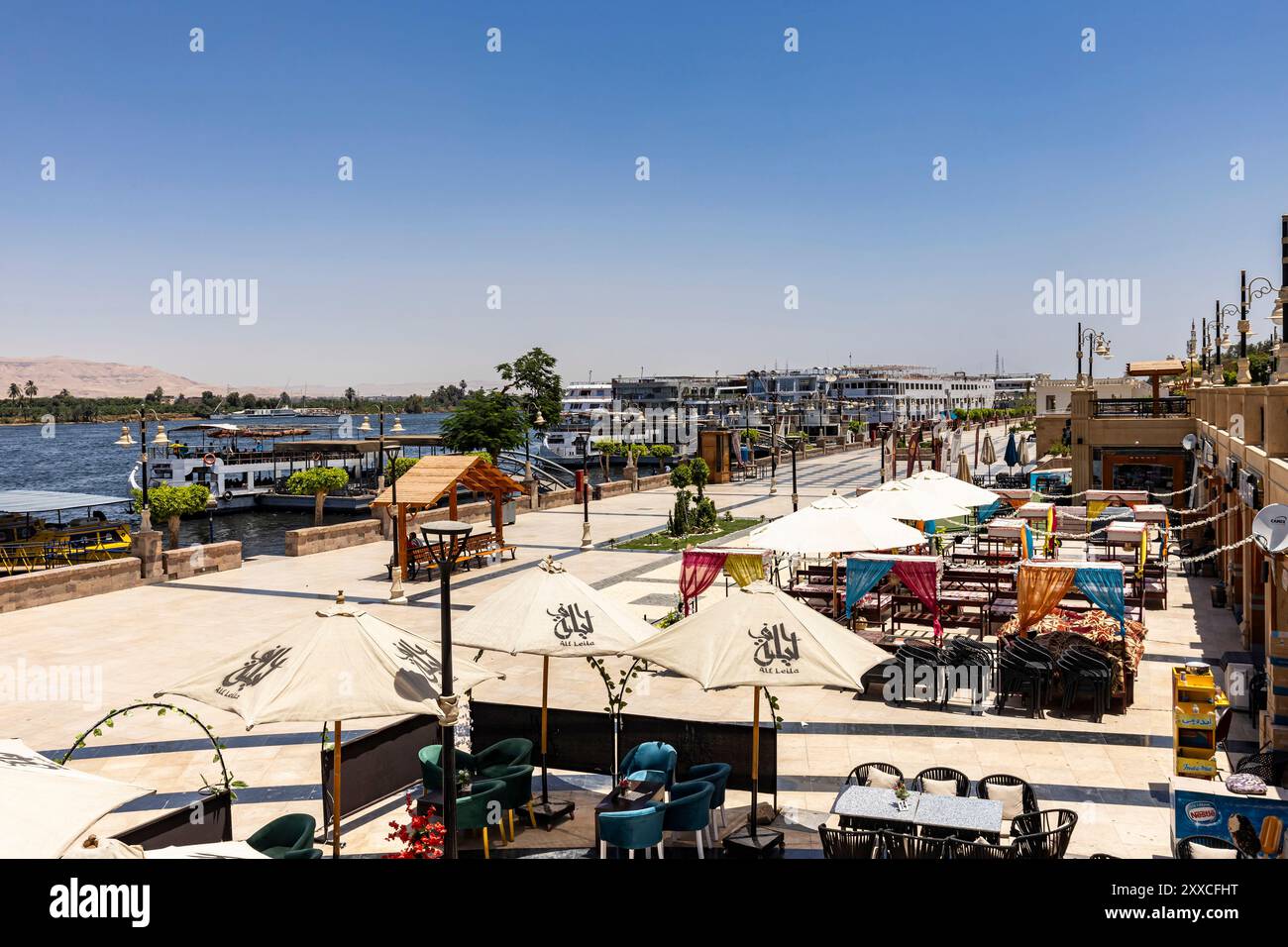 East bank of the Nile, riverside park with ports, downtown, city center ...