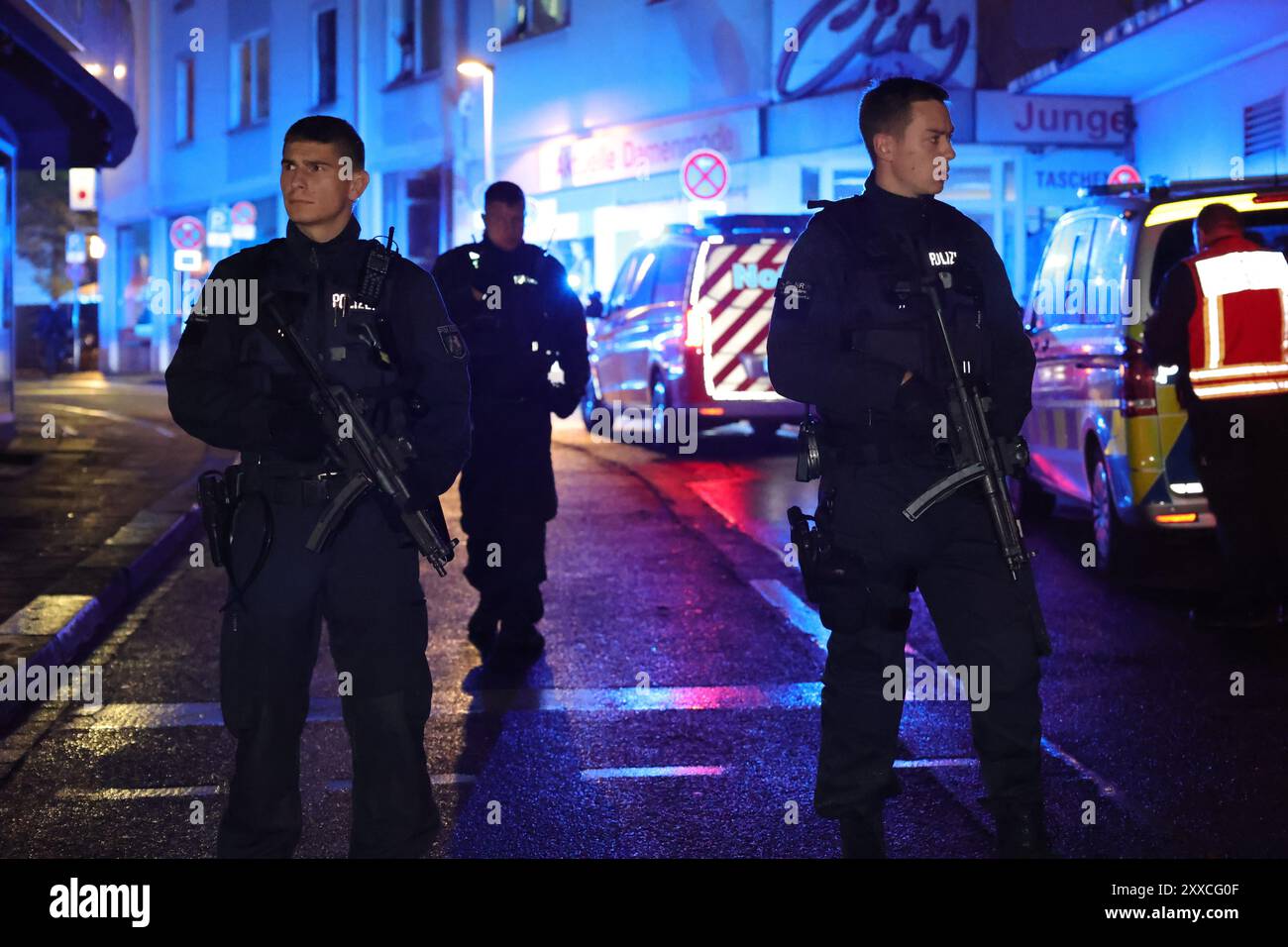Solingen, Germany. 23rd Aug, 2024. Police and ambulances stand near the ...