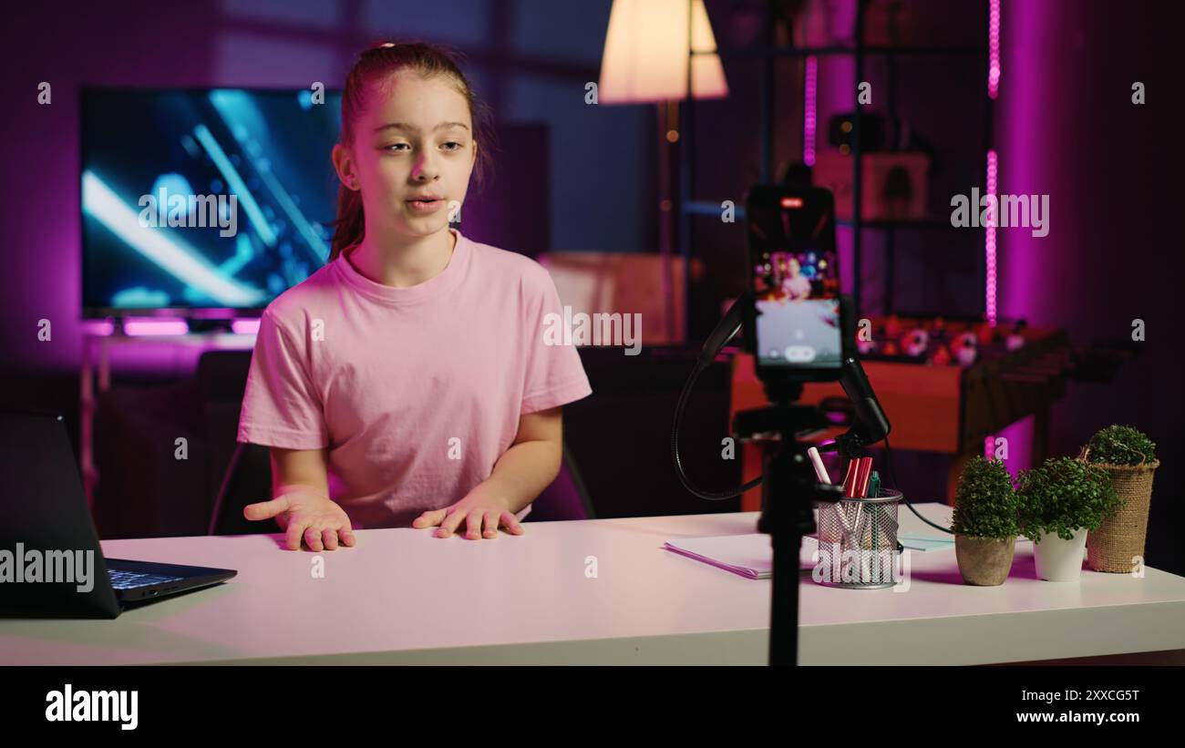 Child filming video with phone on tripod stabilizer for her newly ...