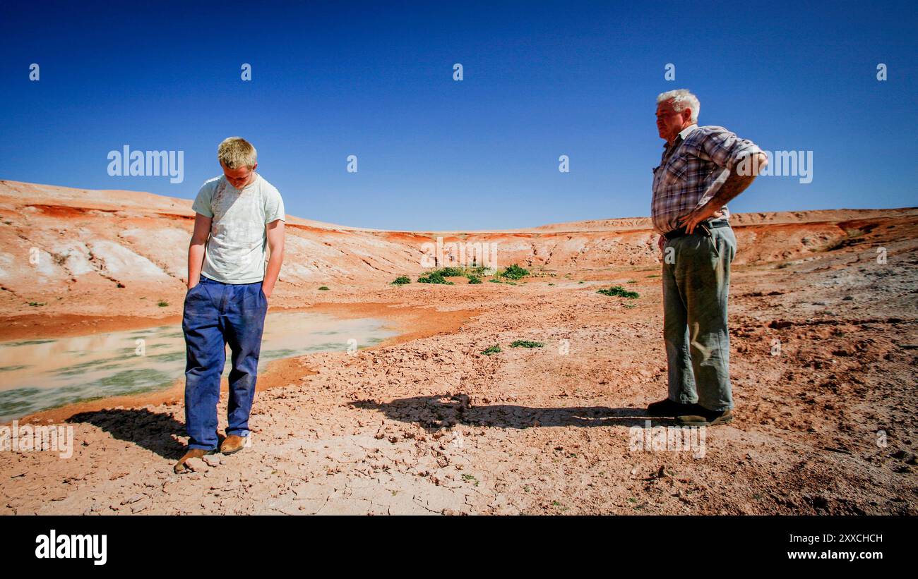 Farmer Frank Sibraa and his grandson walk around at the bottom of an ...