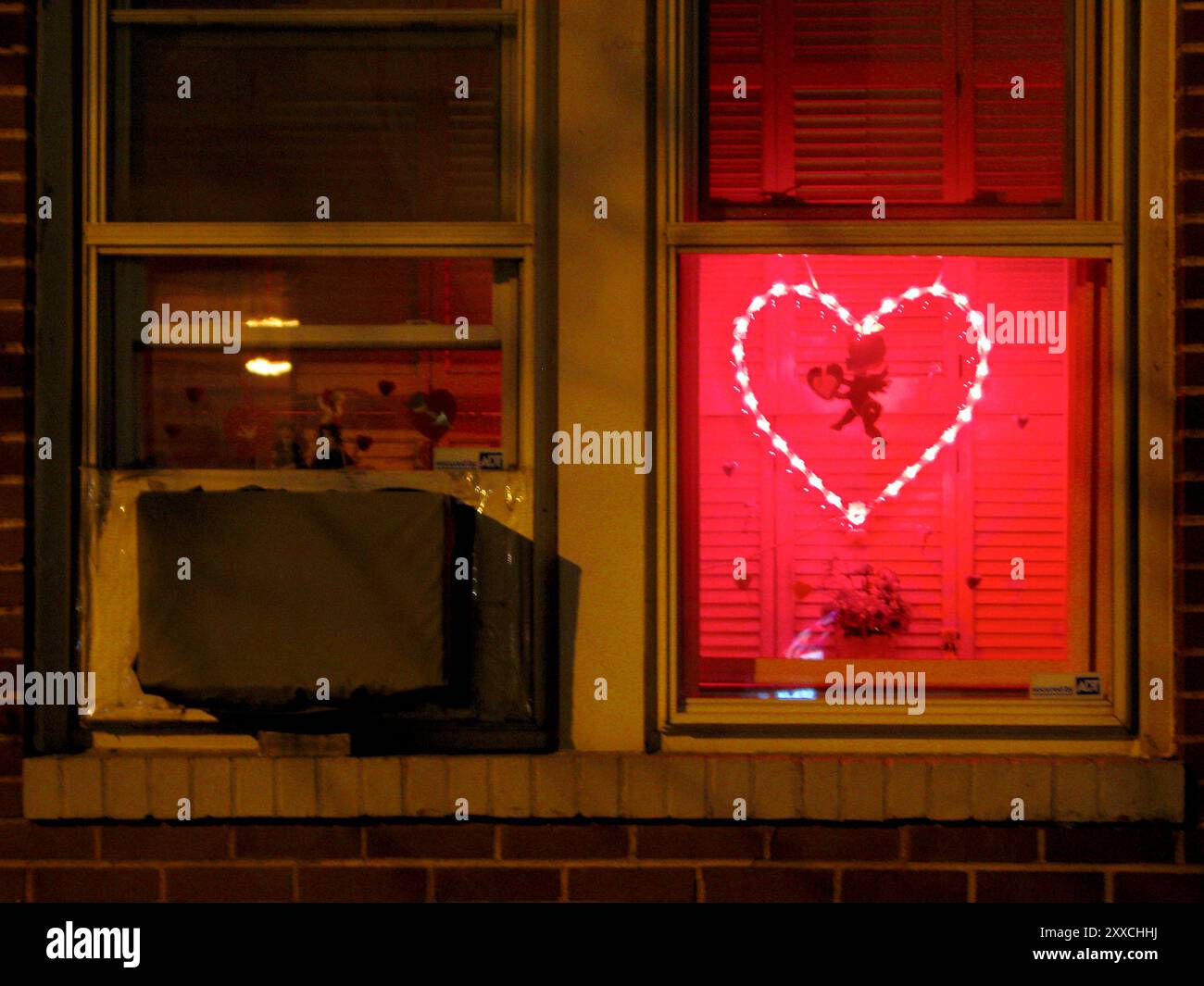 The life in Williamsburg. A window deocration in a basement apartment Stock Photo - Alamy