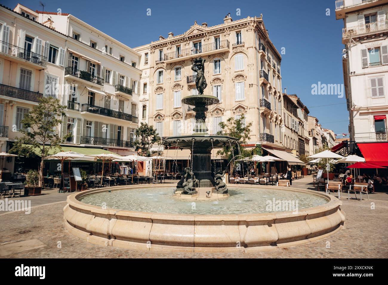 Cannes, France - August 1, 2024: Central square with fountain in Cannes ...