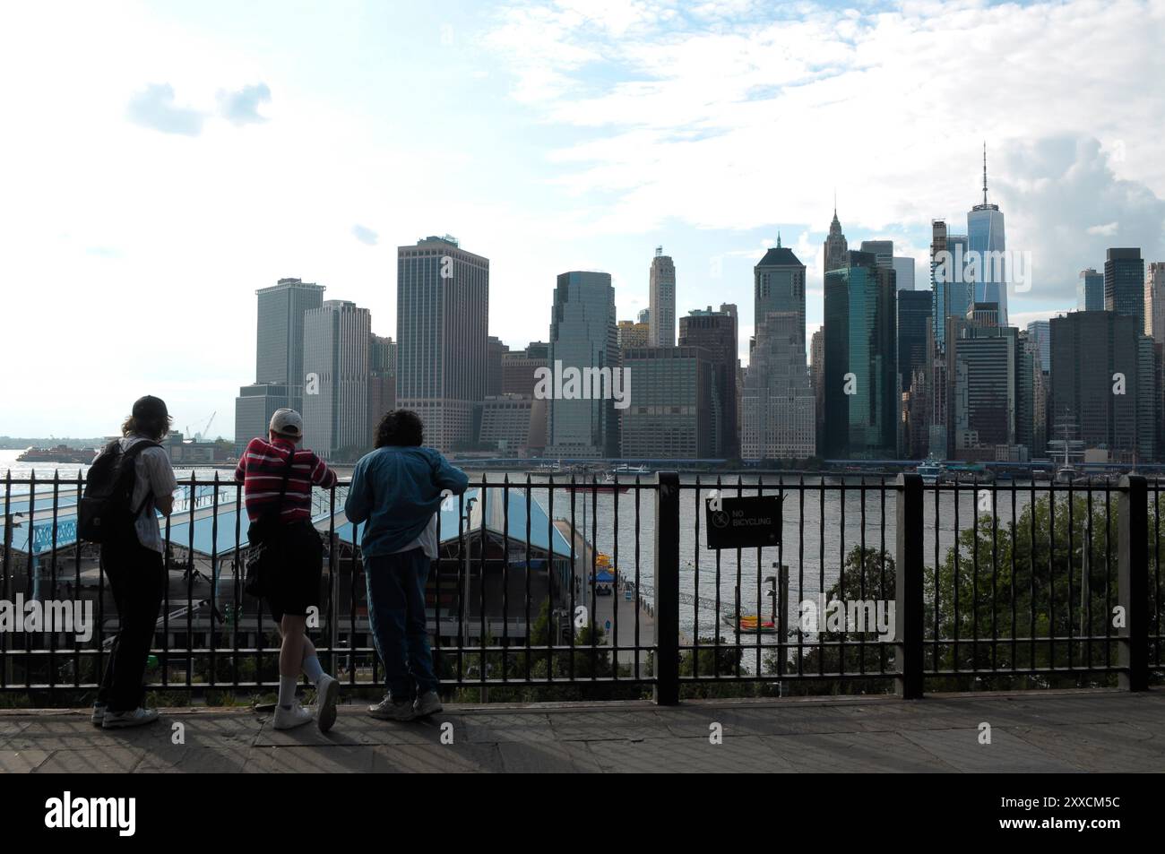 People are seen in Brooklyn Heights in Brooklyn, New York City in front ...
