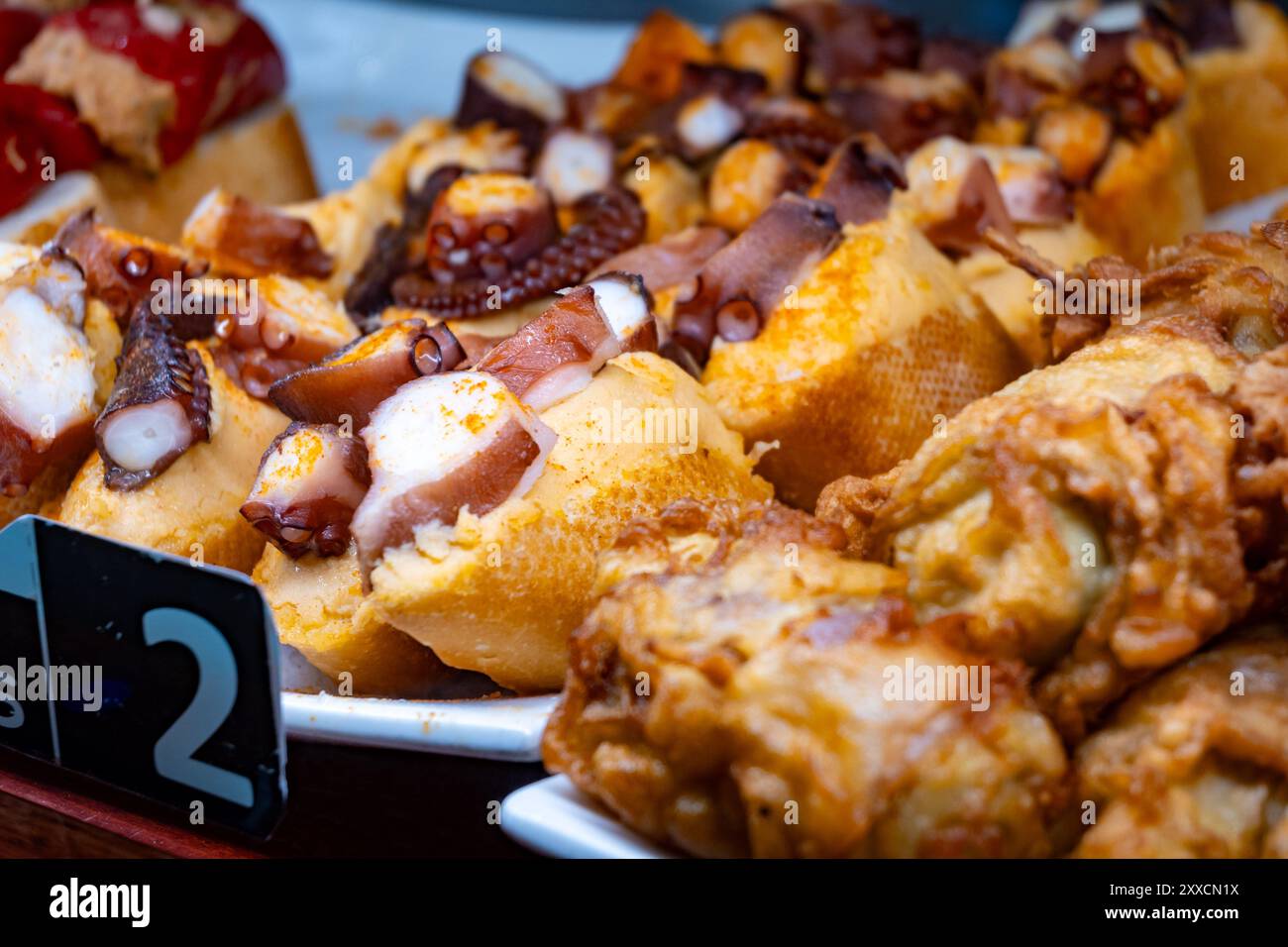 Typical snacks of Basque Country, variety of pinchos or pinxtos oven ...