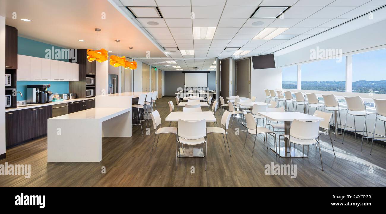 Large employee break room with accordian wall open to meeting space ...