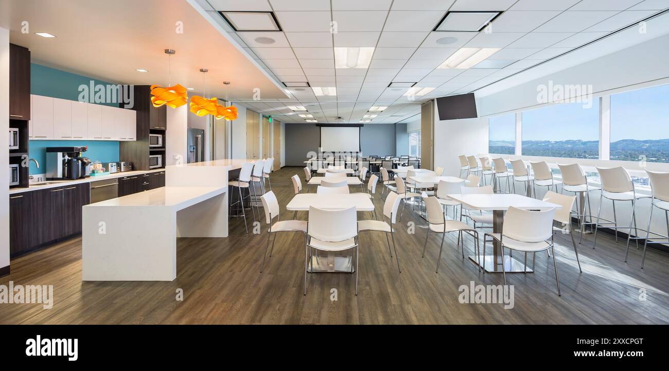 Large employee break room with accordian wall open to meeting space ...
