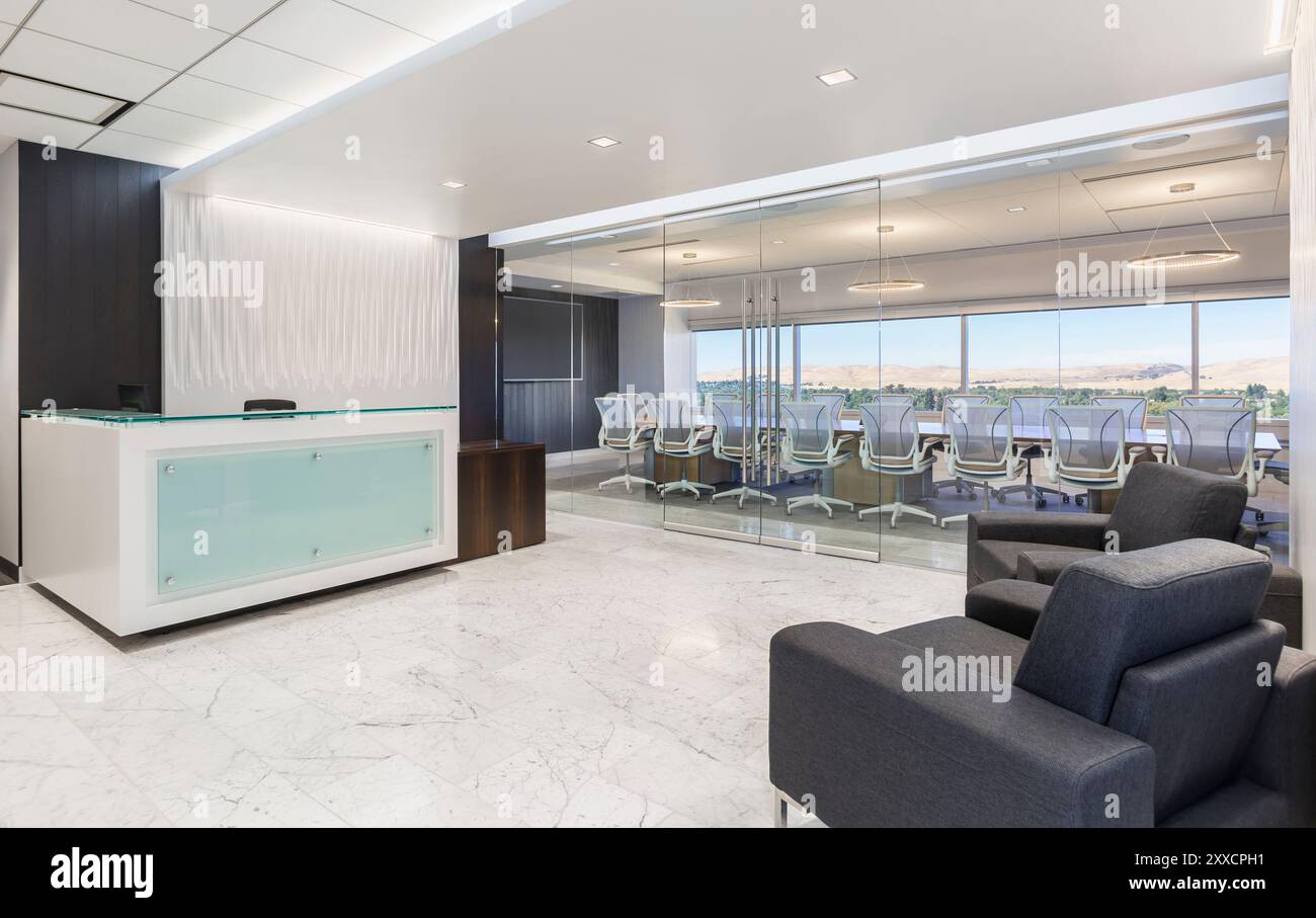 Modern black and white front desk reception area in office with large ...