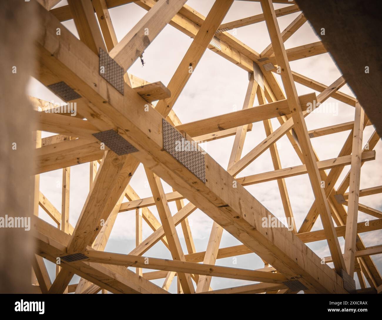 Detailed view of wooden beams and framework structure in a contemporary architectural ...