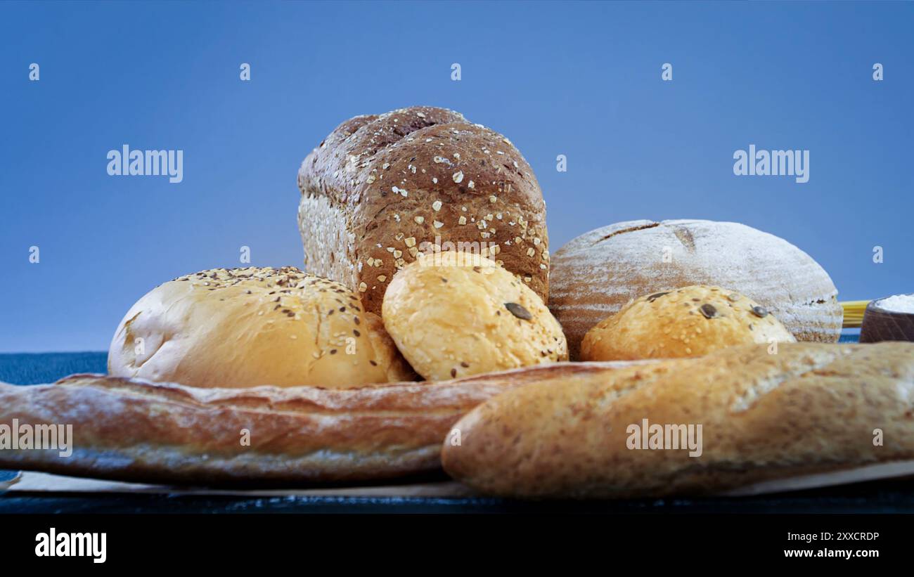 Different types of bread in a rustic basket isolated on a blue ...