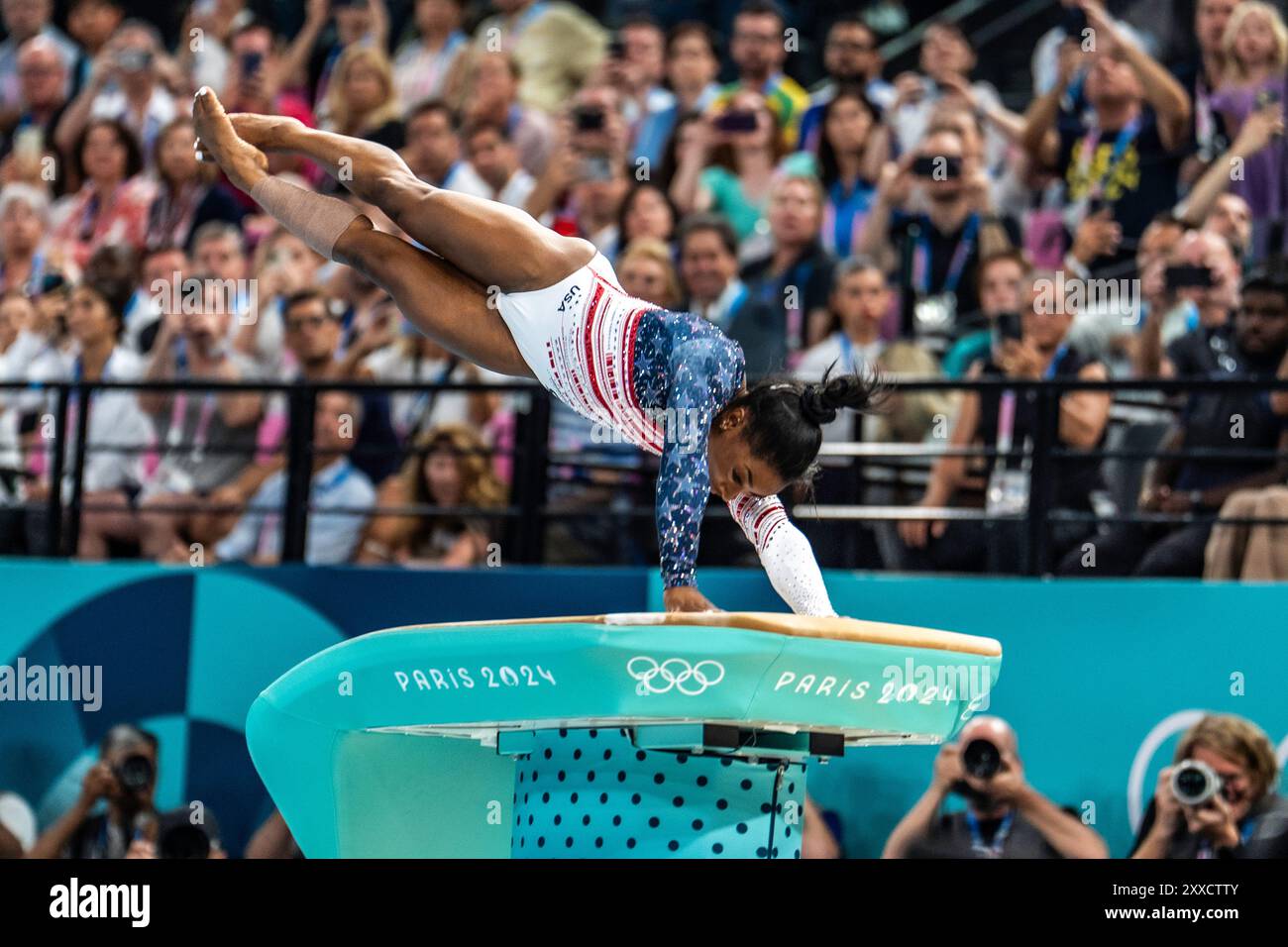 Simone Biles USA) competes on the vault during the Women's Gymnatics ...