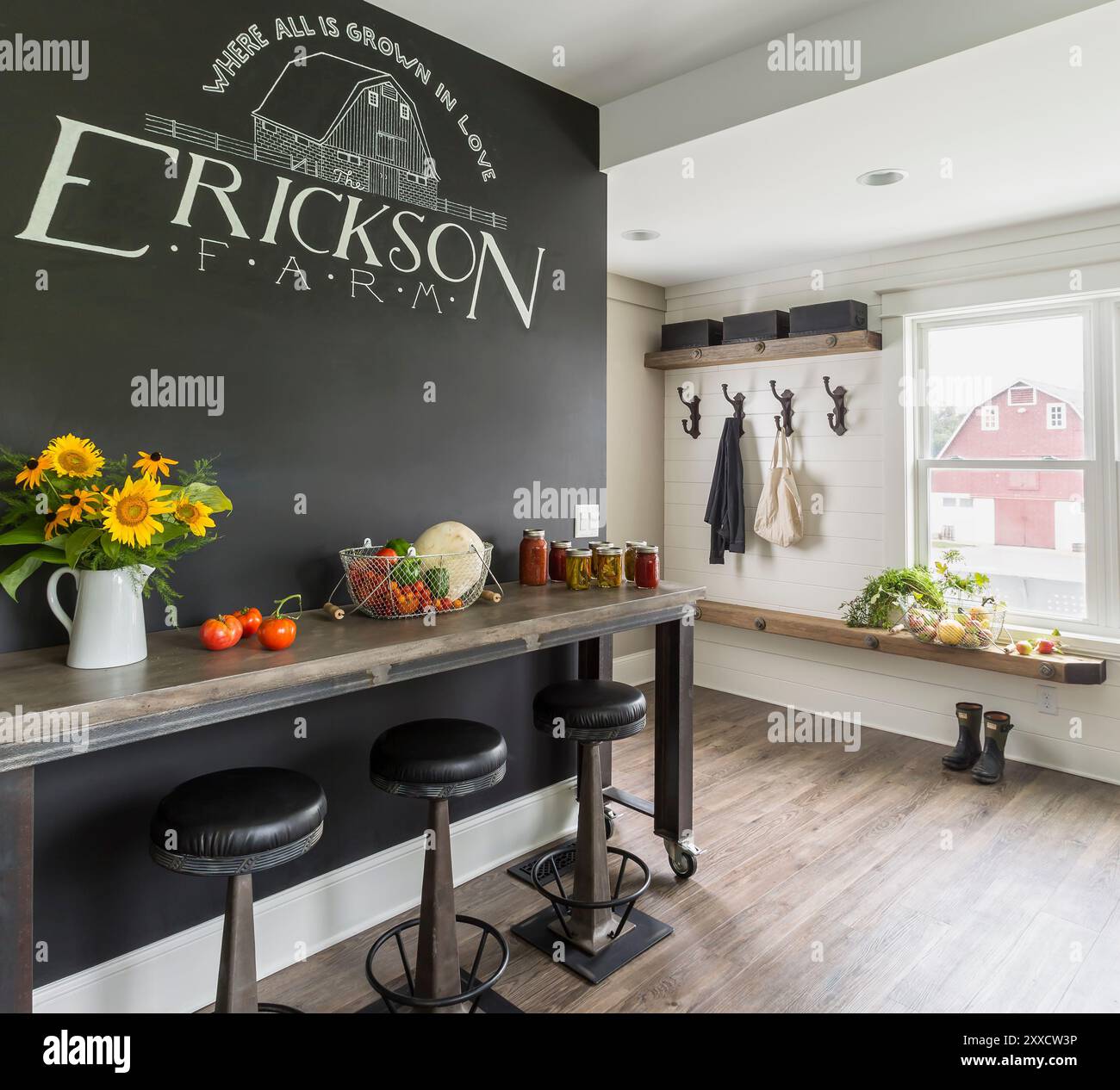 Kitchen counter with food and blackboard painted wall with drawing and ...
