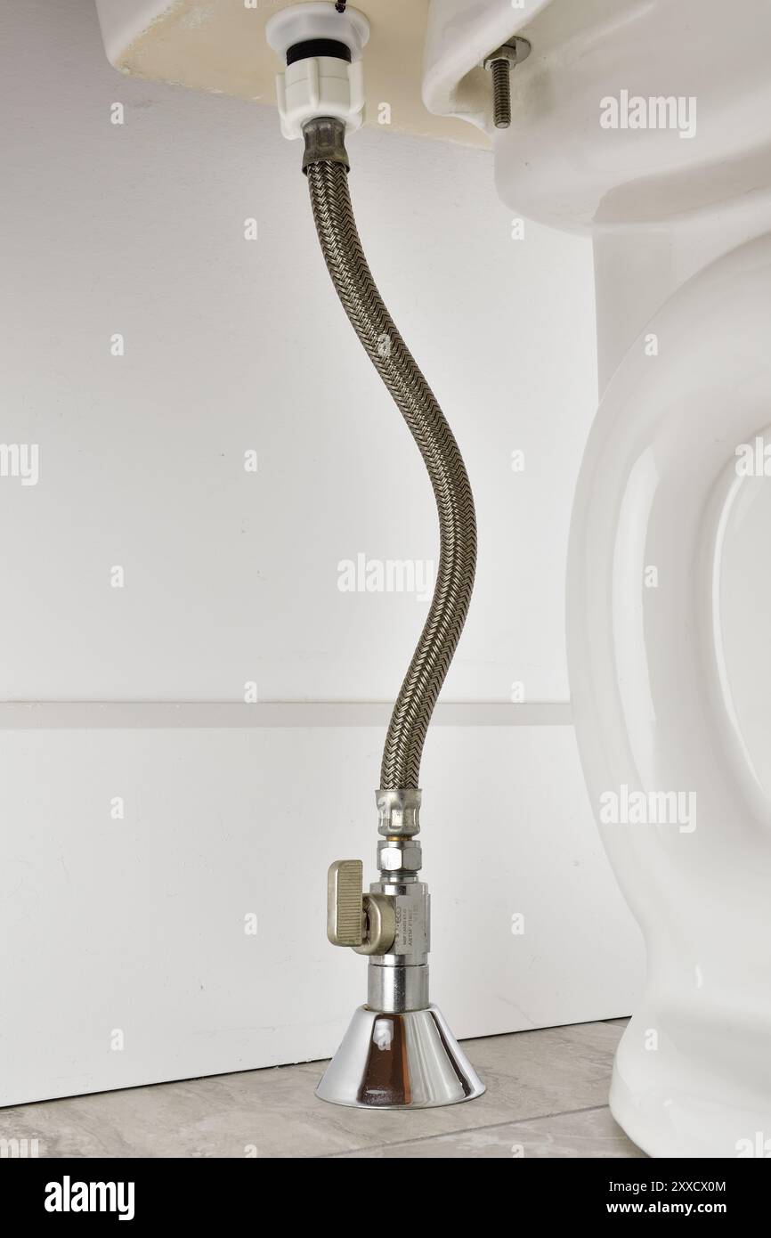 Toilet water feed line. Water valve on toilet inlet with braided hose ...
