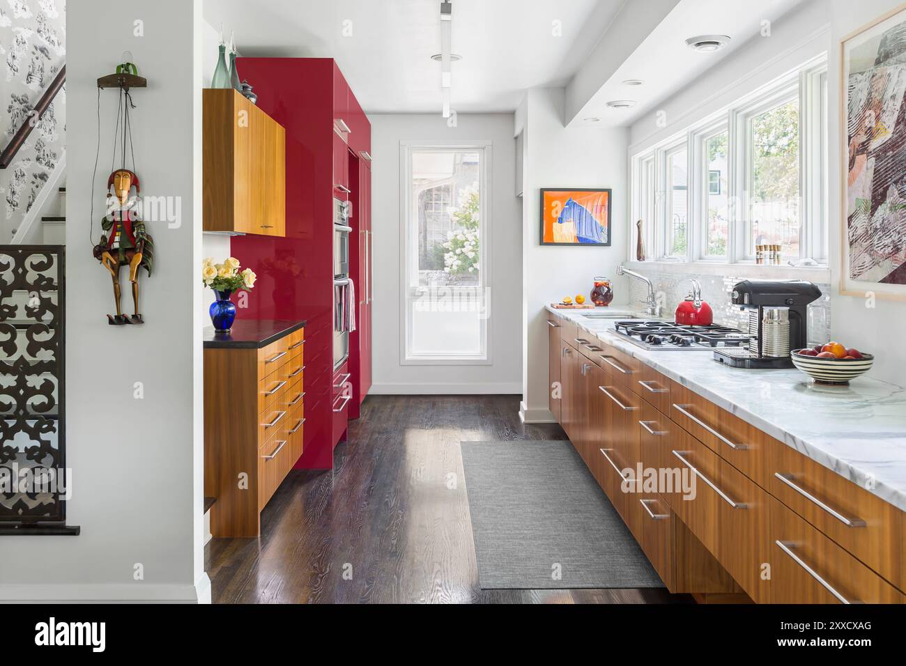 New galley kitchen in older home with modern cabinets on one side and ...
