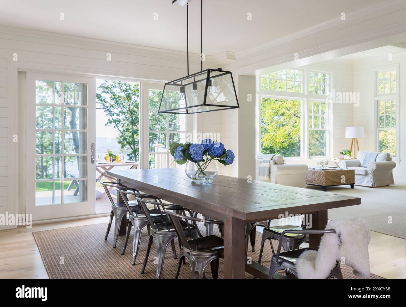 Bright sunny dining room open to living room and outdoor patio Stock ...