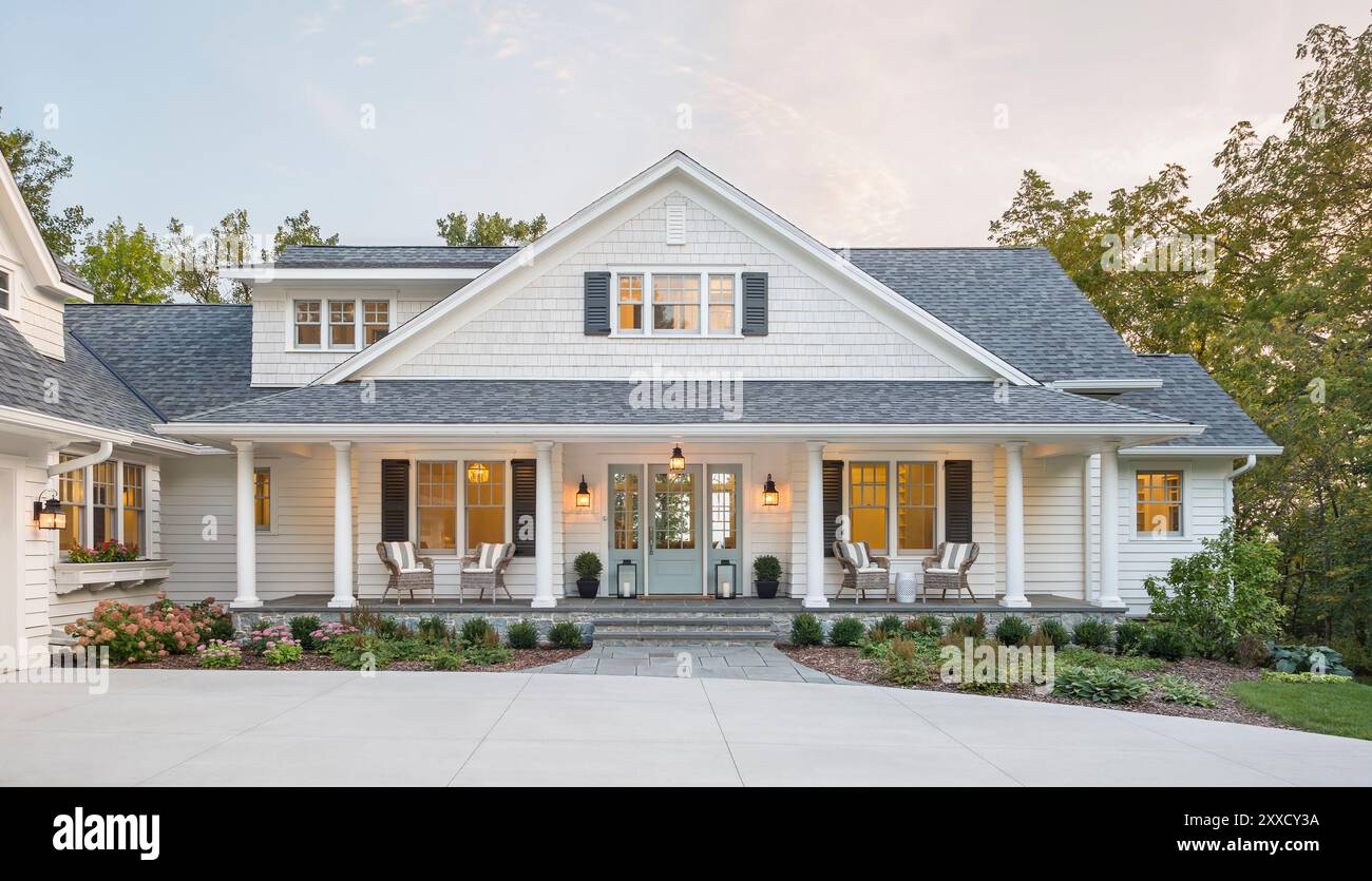 Exterior of white cottage style house with large open porch and front ...