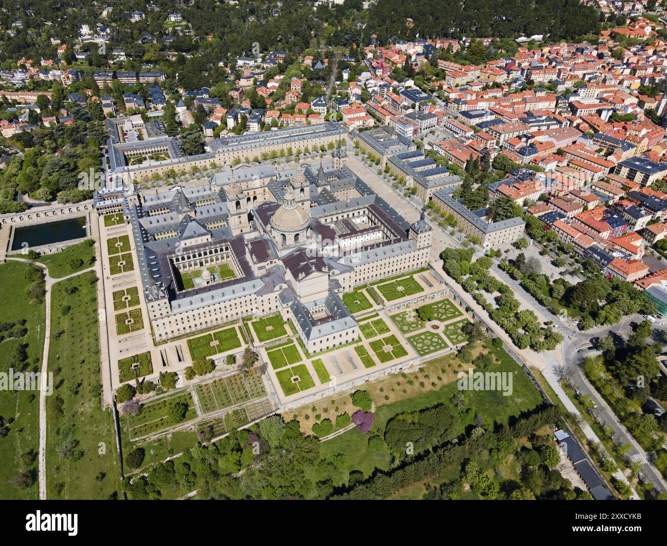 Aerial view of a large palace with surrounding gardens and symmetrical ...