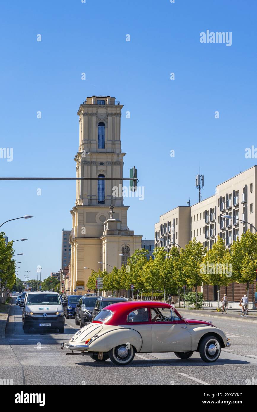 Vintage car in front of the reconstructed baroque tower of the ...