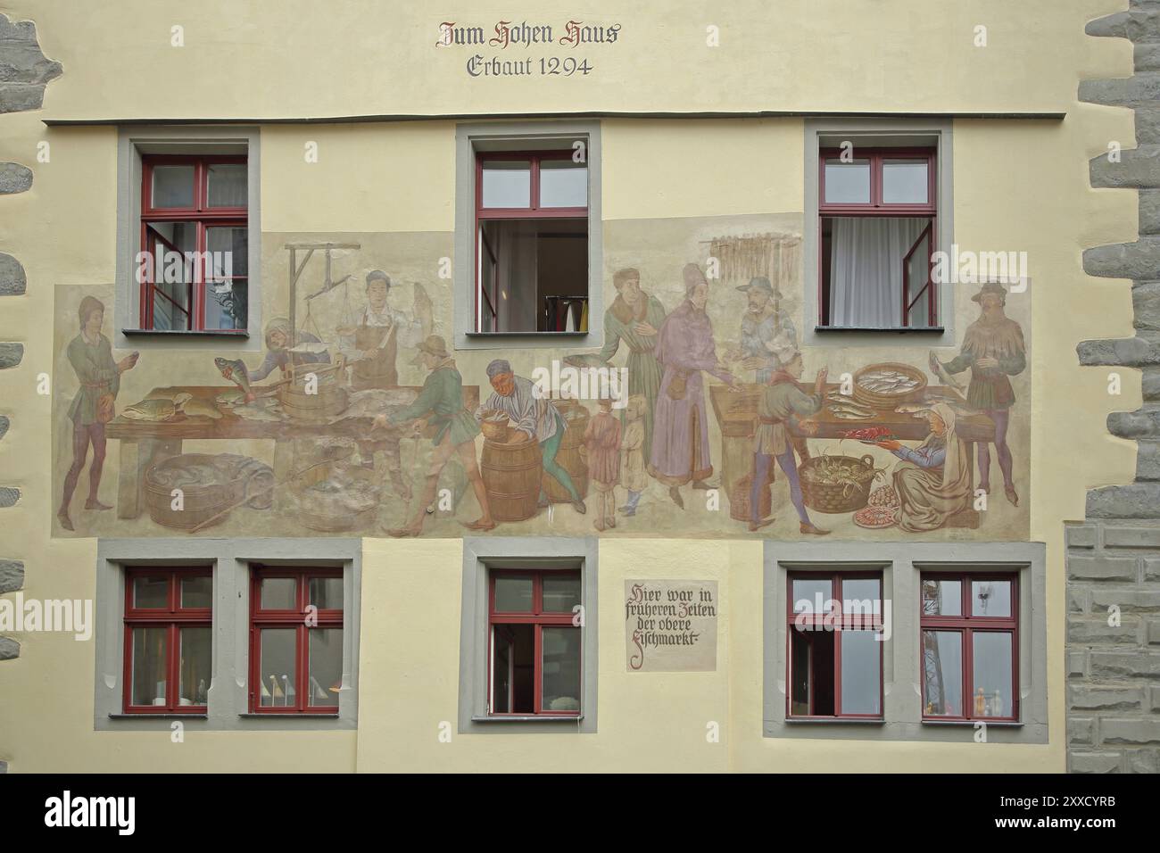 Historical mural with fish market scene, medieval building, inscription ...