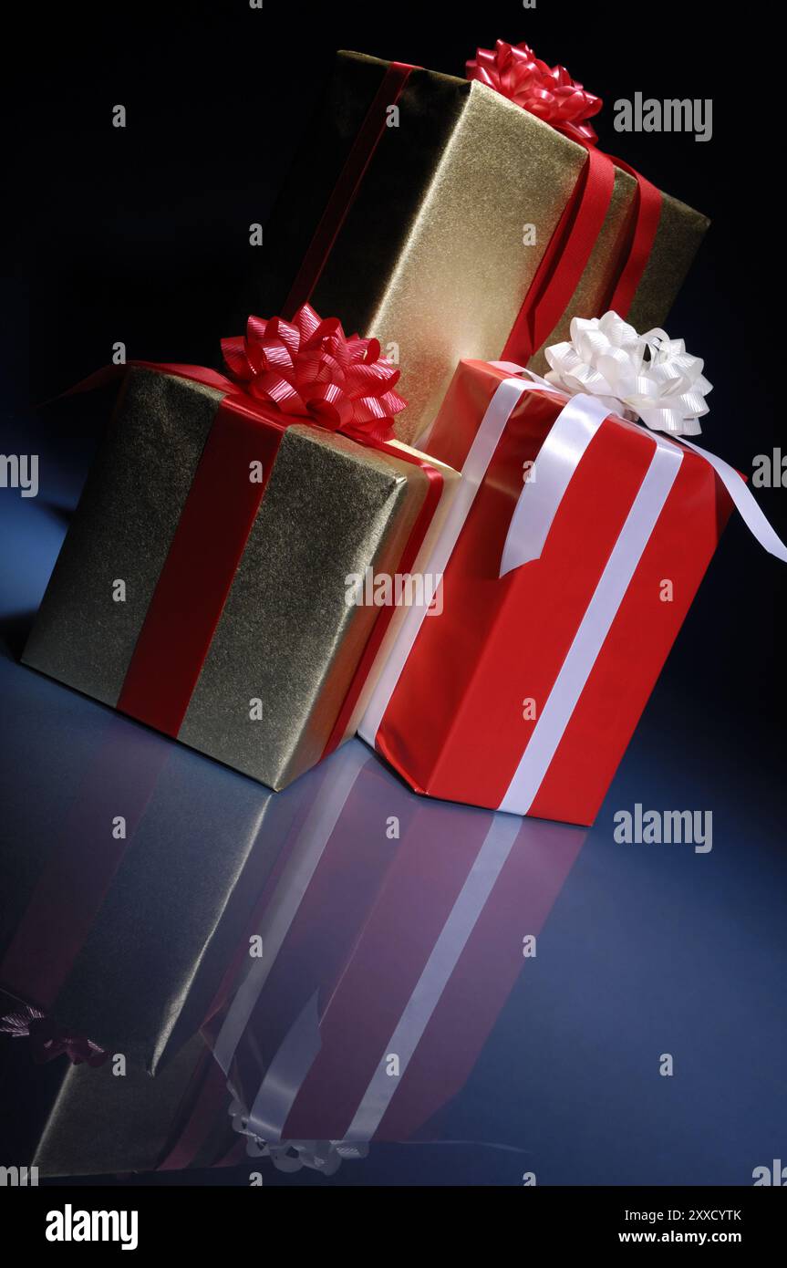 Christmas gift boxes shining in darkness Stock Photo - Alamy