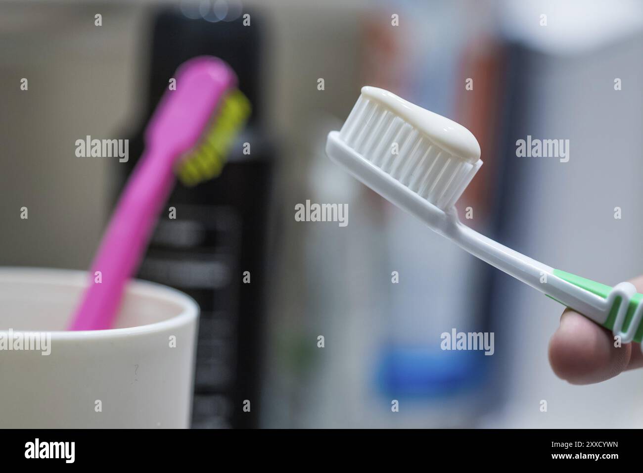 Colorful toothbrush in the bathroom, morning routine Stock Photo - Alamy