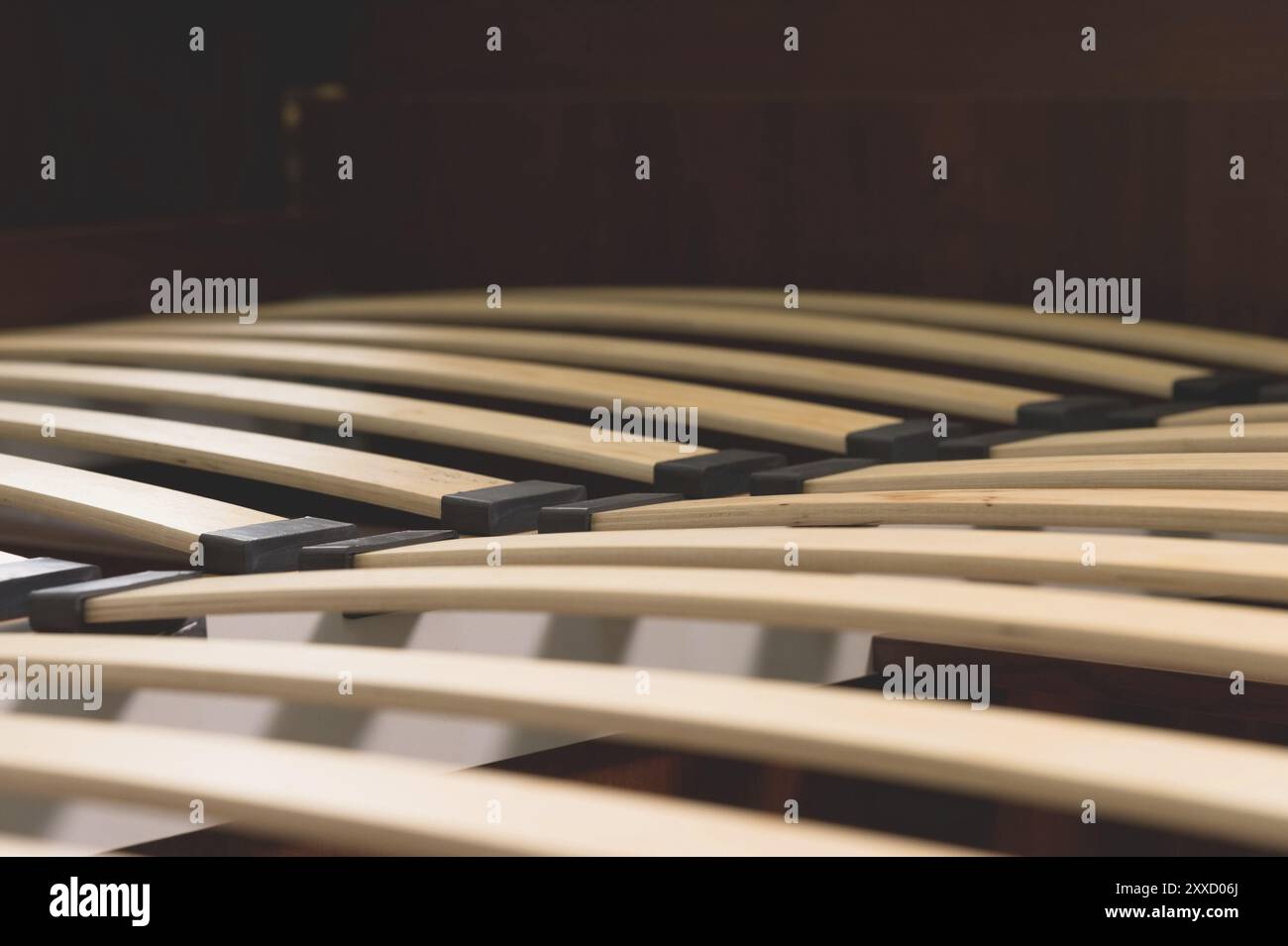Close-up wooden elements of an arthopedic base of a double bed ...