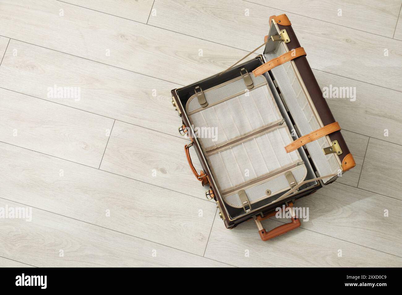 Open empty suitcase on floor indoors, top view. Space for text Stock ...