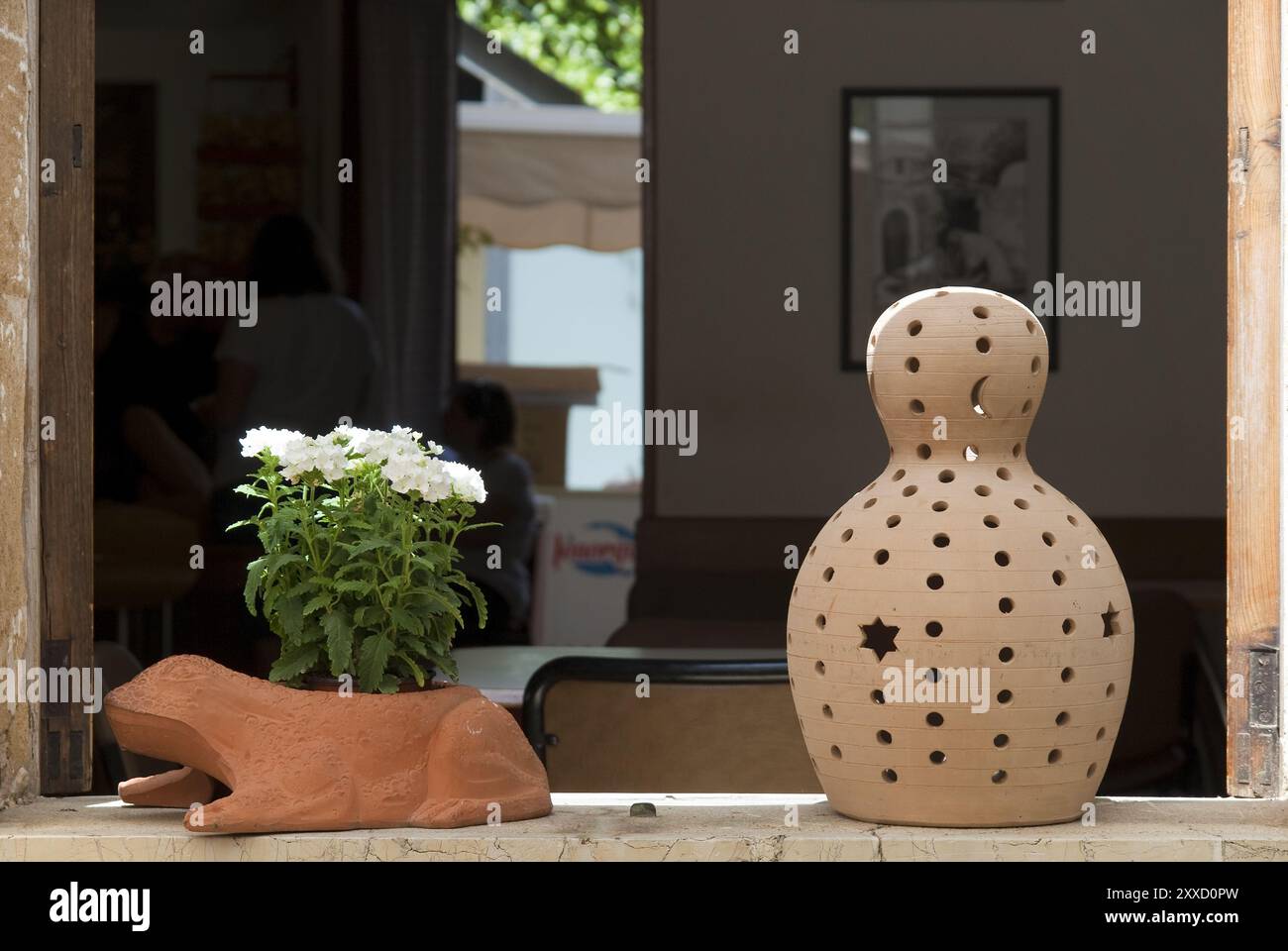 Figures on a windowsill Stock Photo - Alamy