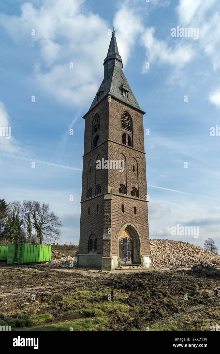 Tower of Borschemich church during demolition. Open-cast mine ...
