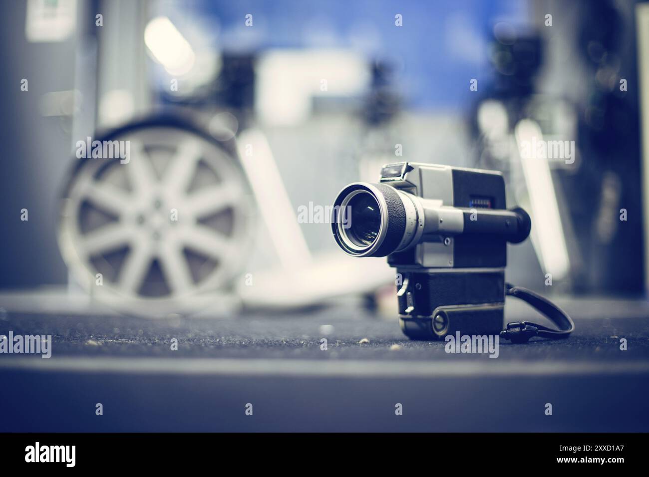 Vintage old movie camera, production studio in the blurry background ...