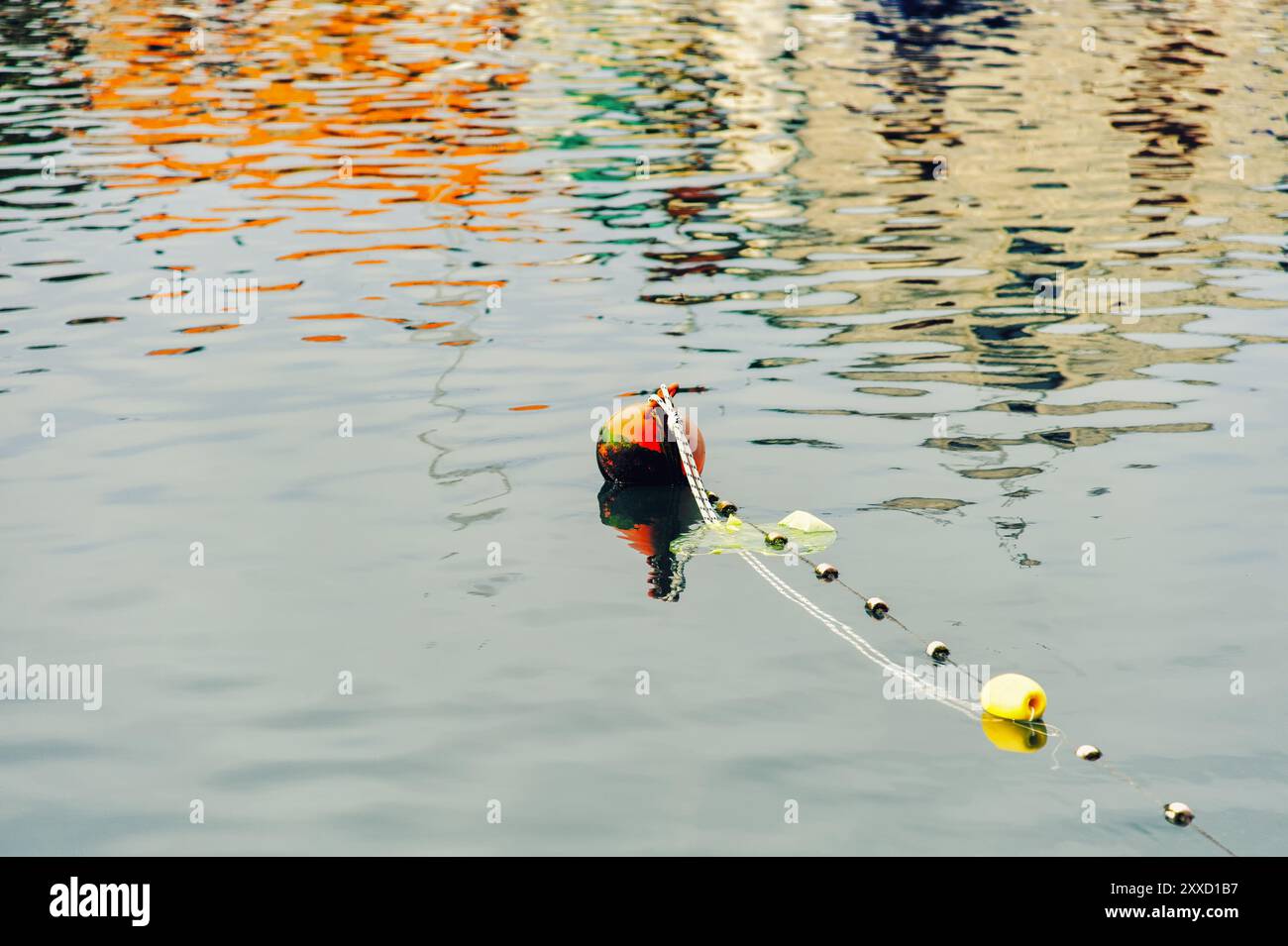 Colourful netball with line and floats in Stari Grad fishing harbour ...