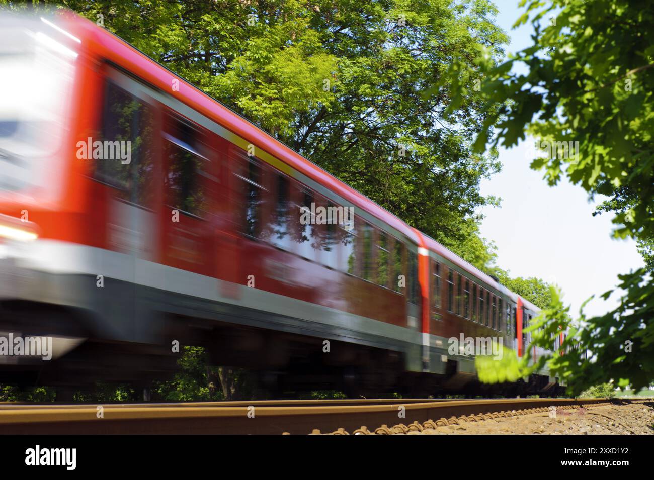 Passing passenger train from the frog's perspective Stock Photo - Alamy